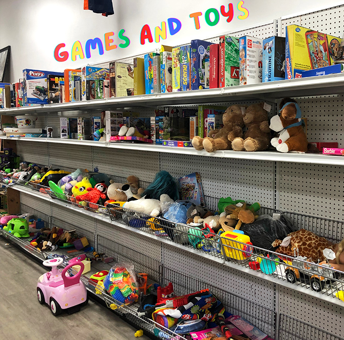 The "Games and Toys" sign promises affordable fun for all ages. One child's outgrown treasure becomes another family's rainy day entertainment solution.