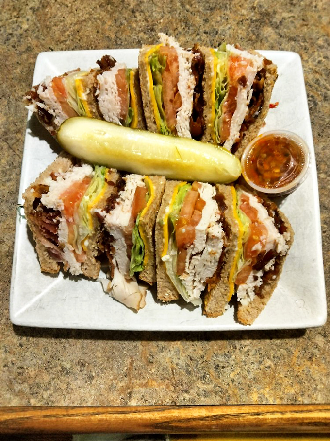 This club sandwich stands taller than most Maryland politicians, layered with turkey, bacon, and fresh veggies&mdash;the pickle is just showing off.
