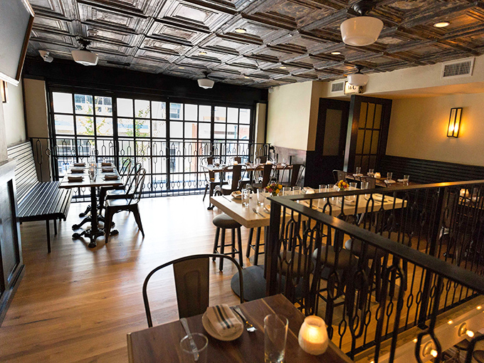 The upper level dining area offers a perfect perch for people-watching through those magnificent windows while contemplating your next meat selection.