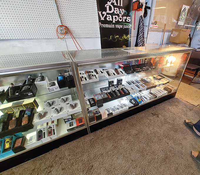 Vape displays gleam under fluorescent lights like a sci-fi movie prop department. The future of smoking looks surprisingly organized.