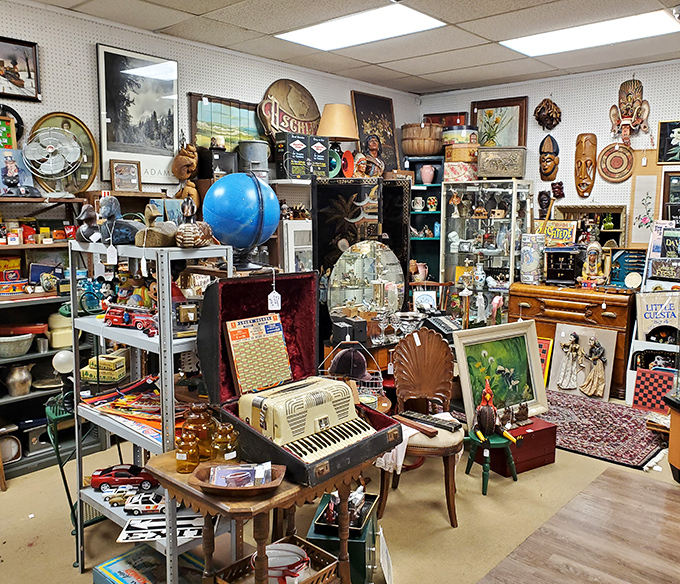 Musical instruments, vintage globes, and forgotten treasures coexist in beautiful chaos. This booth is what your brain looks like after binge-watching "American Pickers."