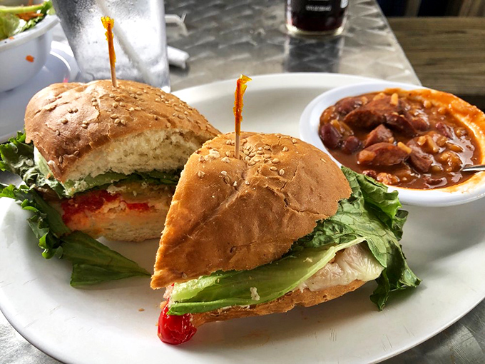 This sandwich isn't just lunch&mdash;it's architecture. Layers of fresh ingredients stacked between golden toast with hash browns playing a crunchy supporting role.