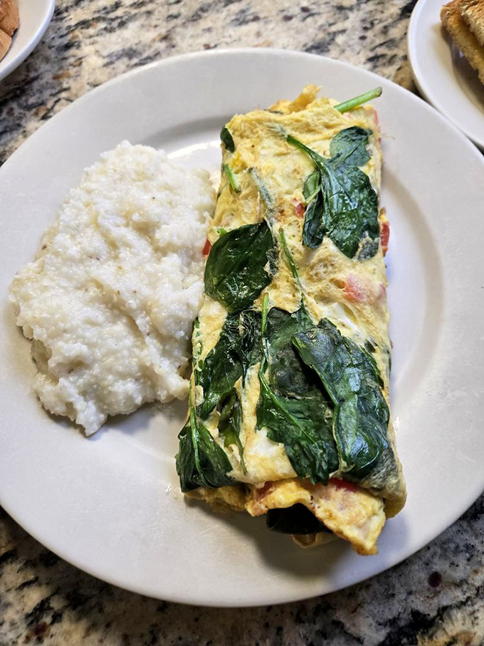 This isn't just an omelet&mdash;it's a garden wrapped in fluffy eggs. The spinach adds color, nutrition, and the illusion of virtue.
