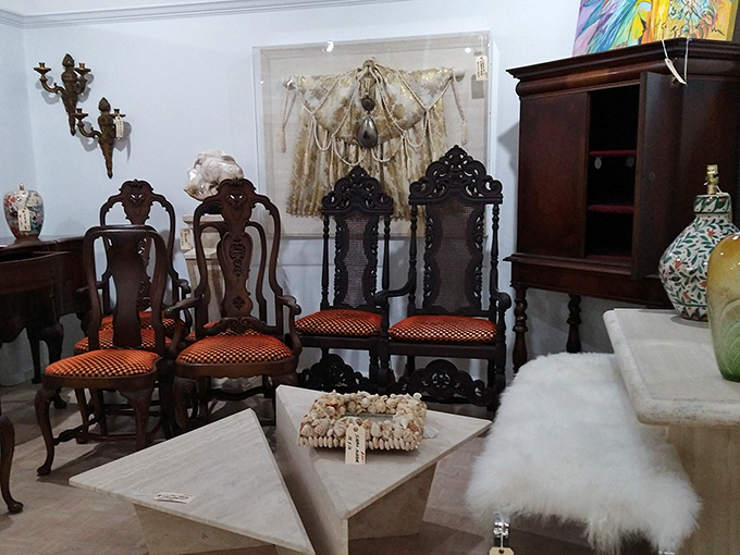 Ornately carved chairs with vibrant orange upholstery prove that antiques don't have to be stuffy&mdash;they can be downright sassy.