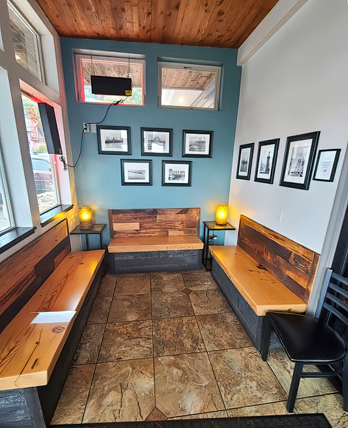 The waiting area feels like the cozy cabin of a luxury fishing vessel, where nautical photographs hint at the ocean's bounty to come.