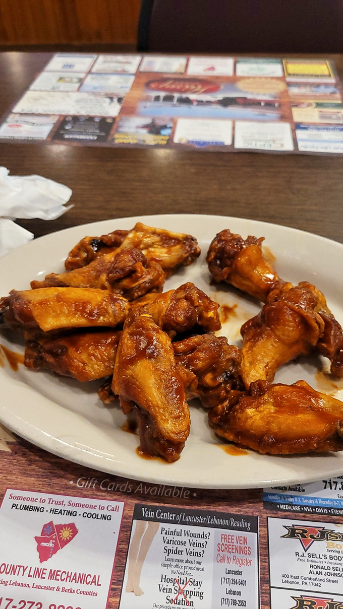 Wings that don't need a sports bar setting to shine. Glistening with sauce and ready to challenge your notion of what diner food can be.