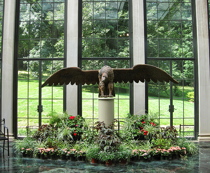 This eagle sculpture surveys the gardens with the confidence of someone who definitely owns the place.