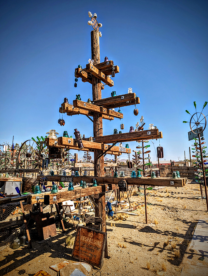 Not your average Christmas tree! This wooden masterpiece adorned with glass ornaments celebrates recycling with artistic flair year-round.