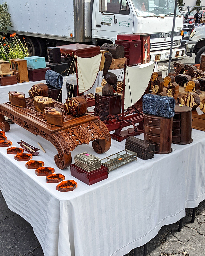 Handcrafted wooden wonders that transform ordinary tables into showcases of maritime craftsmanship and miniature furniture artistry.