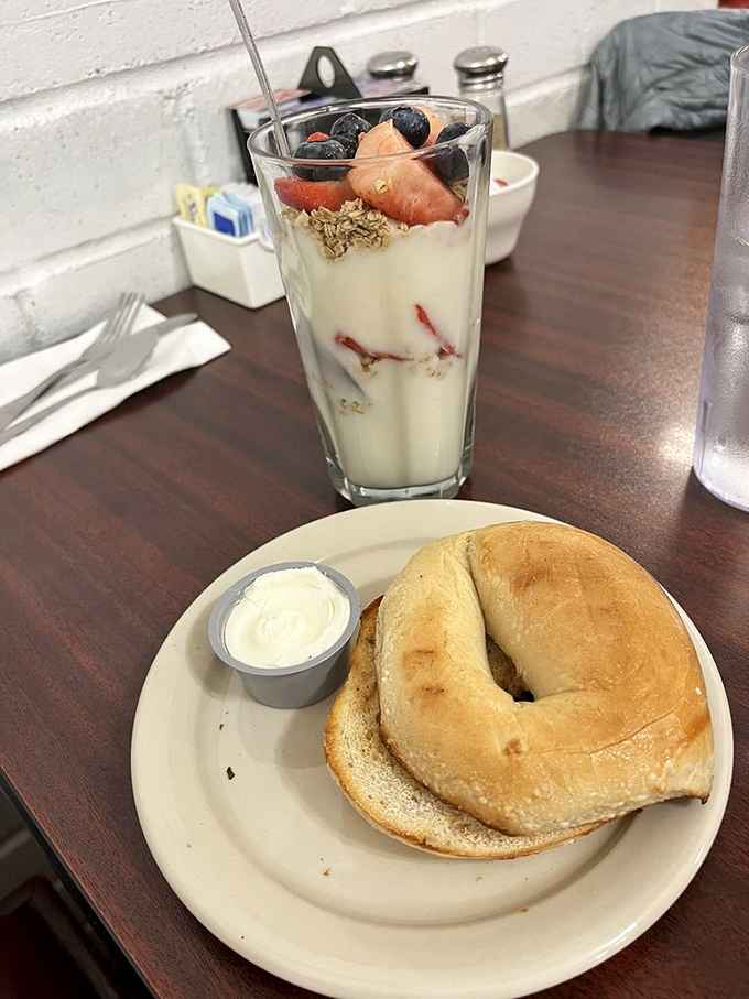 A bagel that's perfectly toasted meets a yogurt parfait that's basically breakfast dessert. Who says you can't have it all?