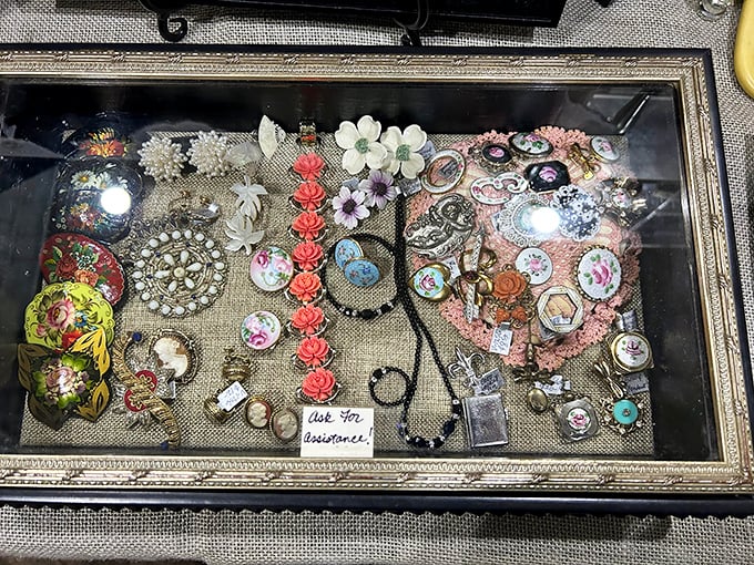 "Look for distance..." the sign suggests, but these vintage brooches and pins demand up-close appreciation of their intricate craftsmanship.