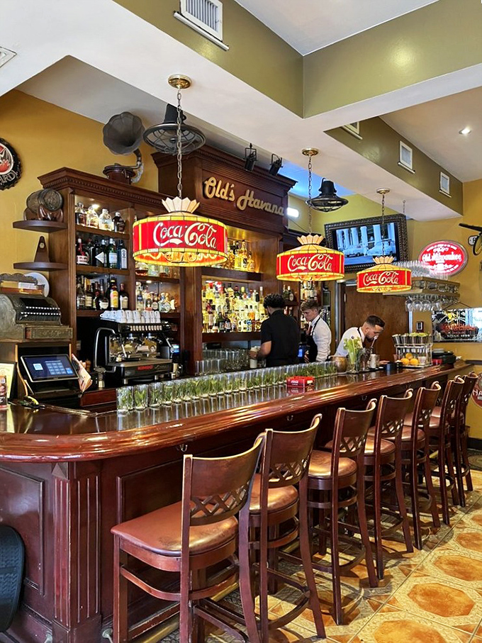 Not just a bar but a liquid museum where vintage Coca-Cola signs illuminate conversations and mojitos flow like Havana gossip.