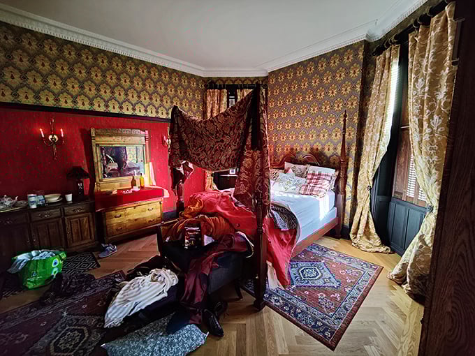 The four-poster bed draped in rich fabrics looks like it's waiting for the ghost of Emily Bront&euml; to drift in and jot down a few haunting verses.