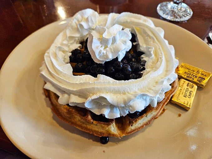 This blueberry waffle with its mountain of whipped cream isn't just breakfast&mdash;it's a celebration on a plate that makes Monday feel like Saturday.