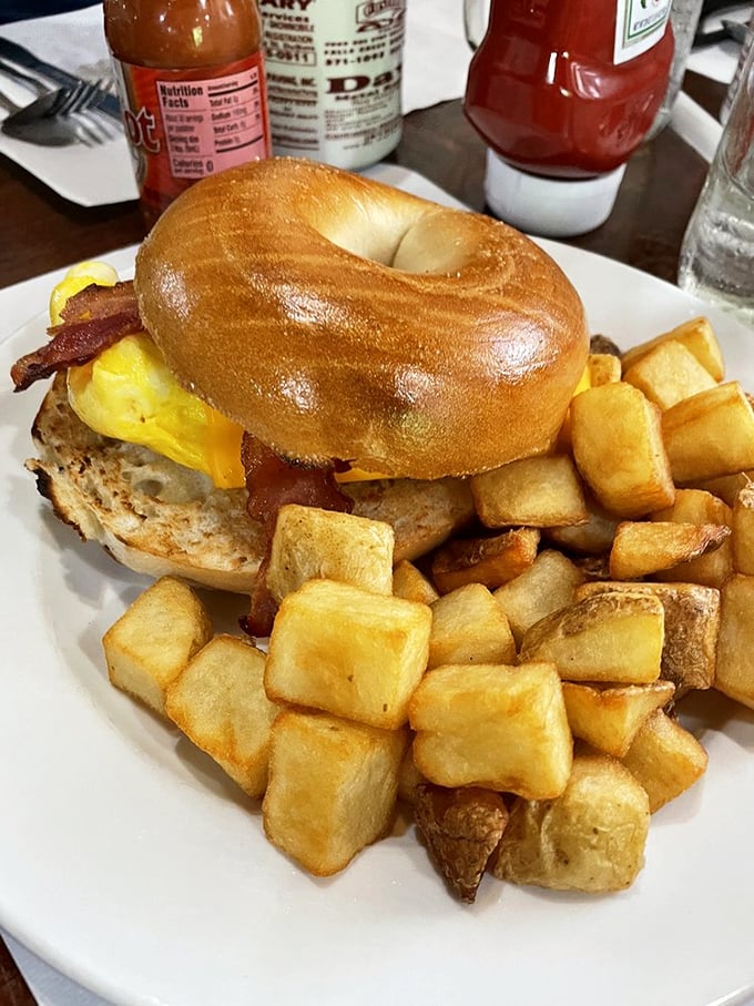 This breakfast sandwich doesn't just start your day &ndash; it makes your day. The perfectly toasted bagel, melted cheese, and home fries are morning's greatest allies.