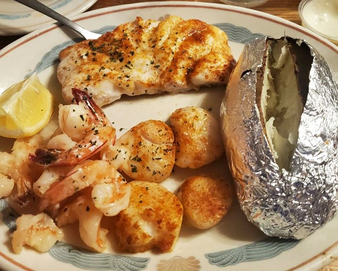 This isn't just a seafood platter &ndash; it's an edible work of art featuring perfectly broiled fish, plump shrimp, and scallops worth fighting over.