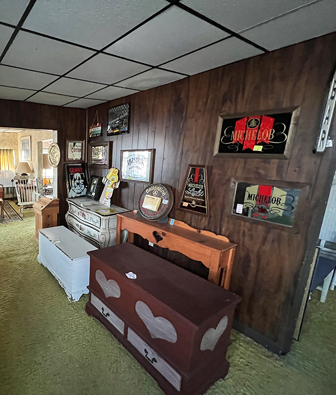 Beer signs and wooden trunks create a man-cave vibe in this corner. That heart-decorated chest probably didn't hold actual hearts&hellip; probably.