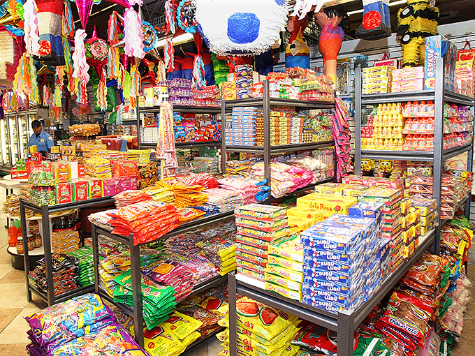 A kaleidoscope of snacks creates a colorful landscape of temptation. This candy wonderland would make Willy Wonka himself stop in his tracks.