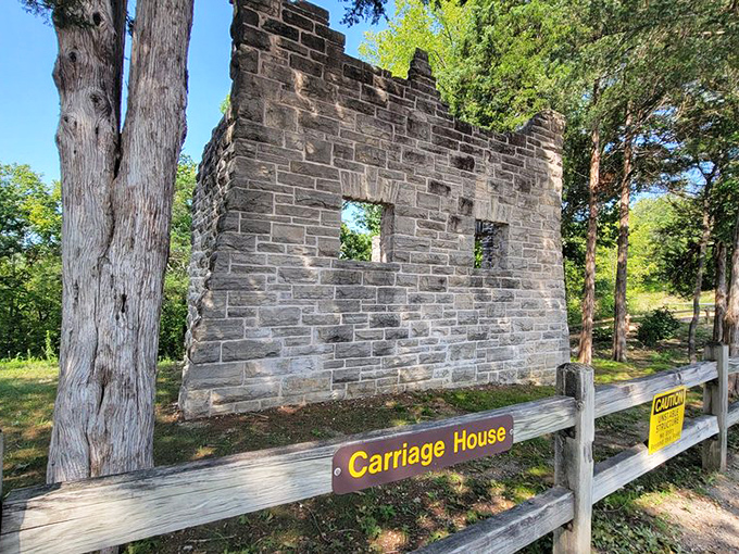 The carriage house stands sentinel, reminding visitors that even castles needed practical storage solutions back then.
