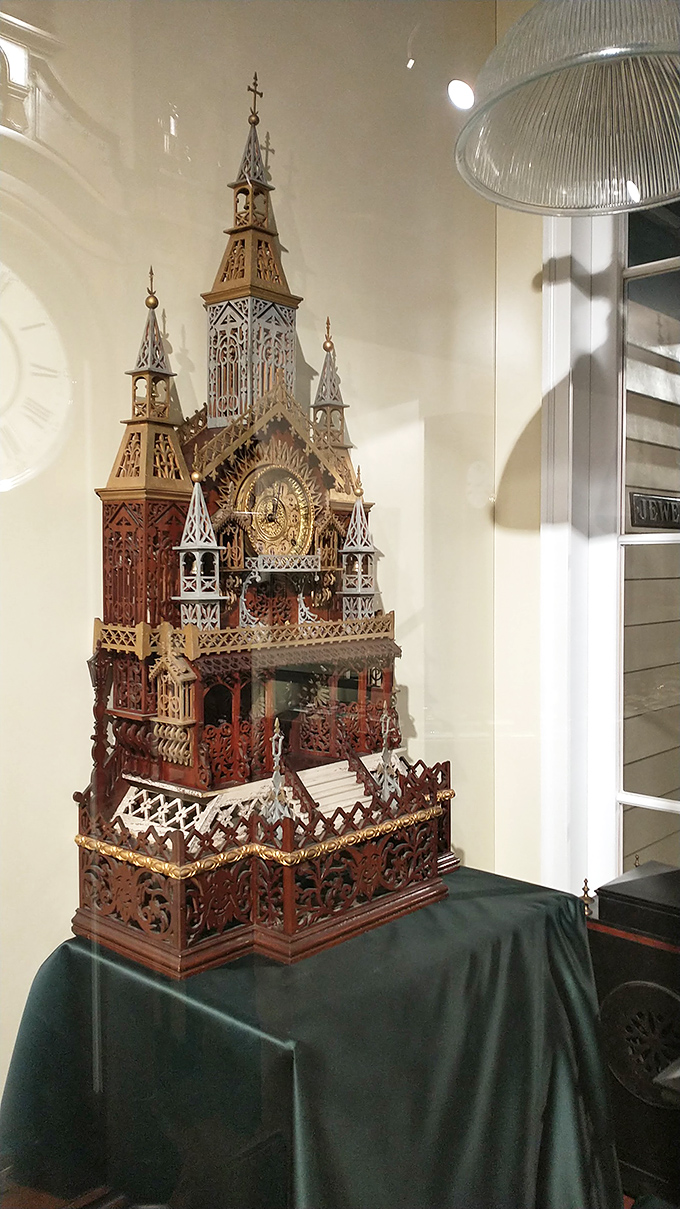 This intricate wooden cathedral clock is architecture in miniature—the kind of timepiece that makes you wonder if tiny bell-ringers live inside.