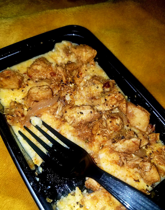 Comfort food elevated: tender chicken nestled in creamy grits. Southern hospitality served in a convenient to-go container.
