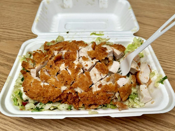 When fried chicken meets vibrant slaw, magic happens. This deconstructed sandwich reveals the care put into each component.