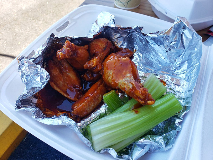 Wings that don't need a sports bar to shine. That celery stick isn't garnish—it's the universe's way of making you feel virtuous while indulging.