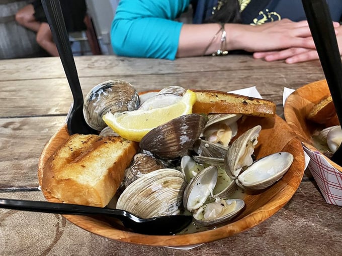 Steamed clams swimming in garlicky broth with toasted bread for dipping&mdash;nature's perfect design for turning humans into happy, messy eaters.