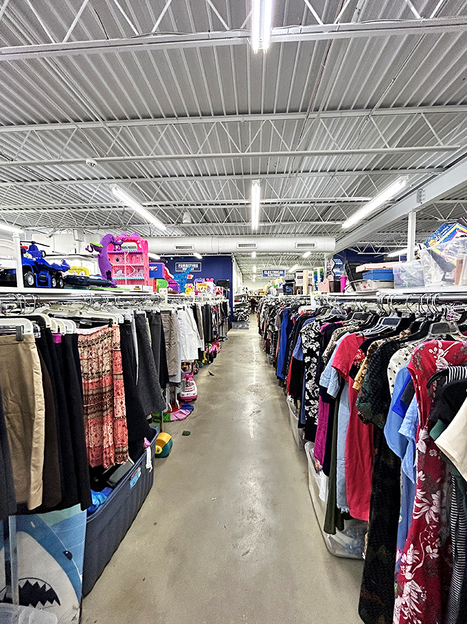 The clothing aisles stretch like a textile Grand Canyon. Each hanger holds potential&mdash;someone's "too small" might be your "fits just right."