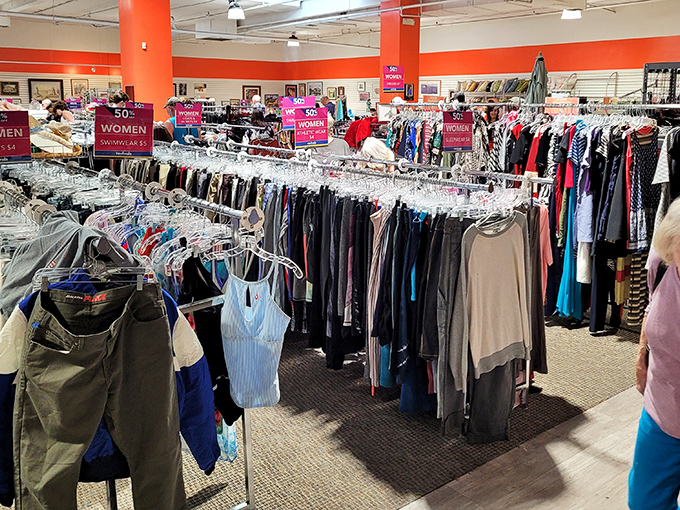 The clothing section stretches toward the horizon like a textile Grand Canyon. Each rack contains potential wardrobe revolutions waiting to be discovered.