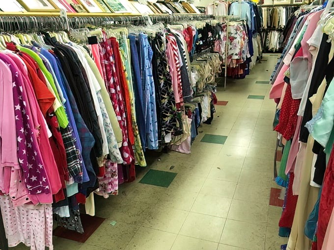 The clothing rainbow! Every hue imaginable hangs in neat rows, proving that sustainable fashion doesn't mean sacrificing color or variety.