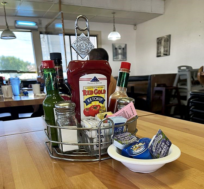 The condiment caddy&mdash;that unsung hero of diner tables everywhere. Hot sauce, ketchup, and sweeteners standing by for your personal touch.