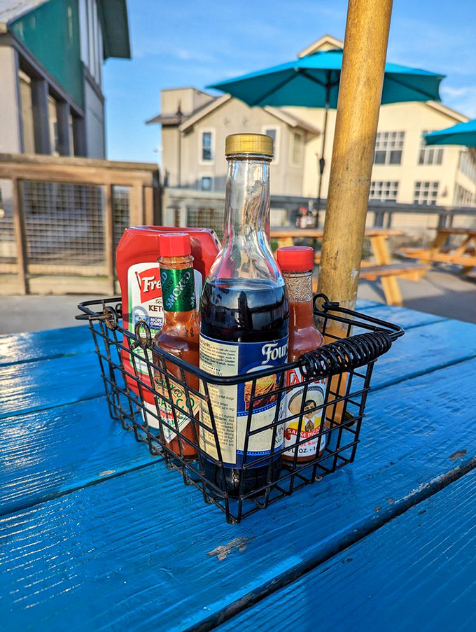 The condiment basket&mdash;that humble hero of tableside customization. Malt vinegar, hot sauce, ketchup&mdash;your fish's backup dancers are ready to perform.