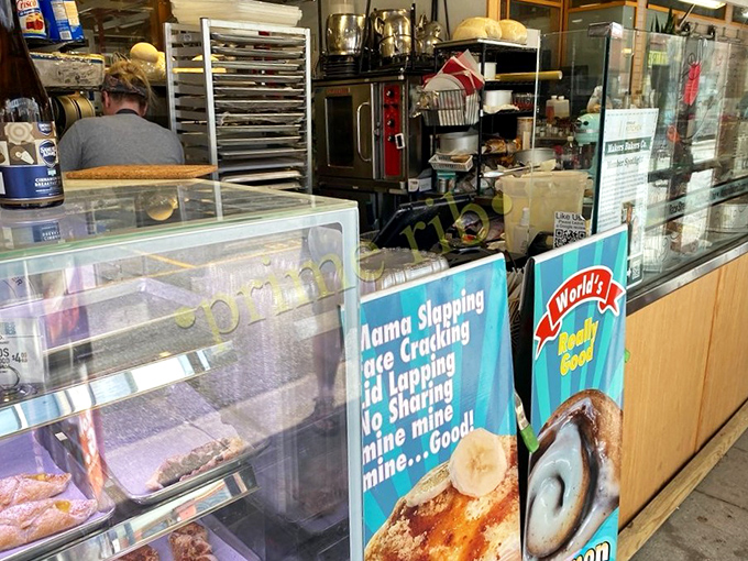 Behind the counter where the magic happens. That "No Sharing" sign on the banana pudding poster speaks the universal language of "too good to share."