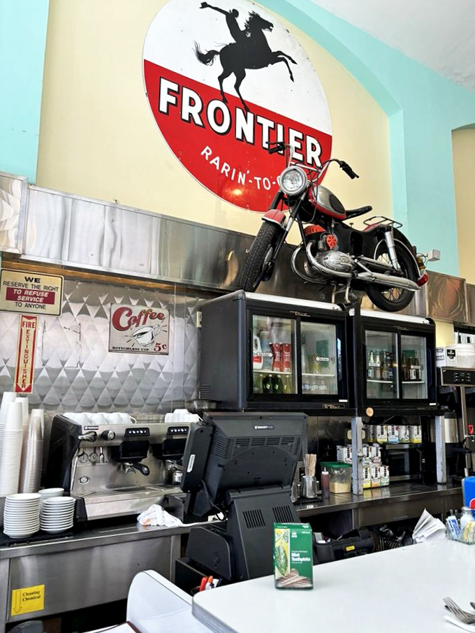 That motorcycle isn't just decoration&mdash;it's watching over the coffee station like a mechanical guardian angel of caffeine and nostalgia.
