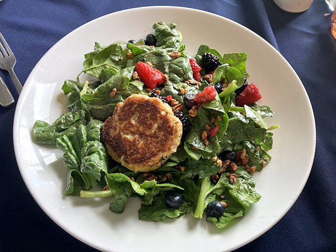 This crab cake isn't playing supporting actor to those berries and greens &ndash; it's the undisputed star with a well-deserved spotlight.