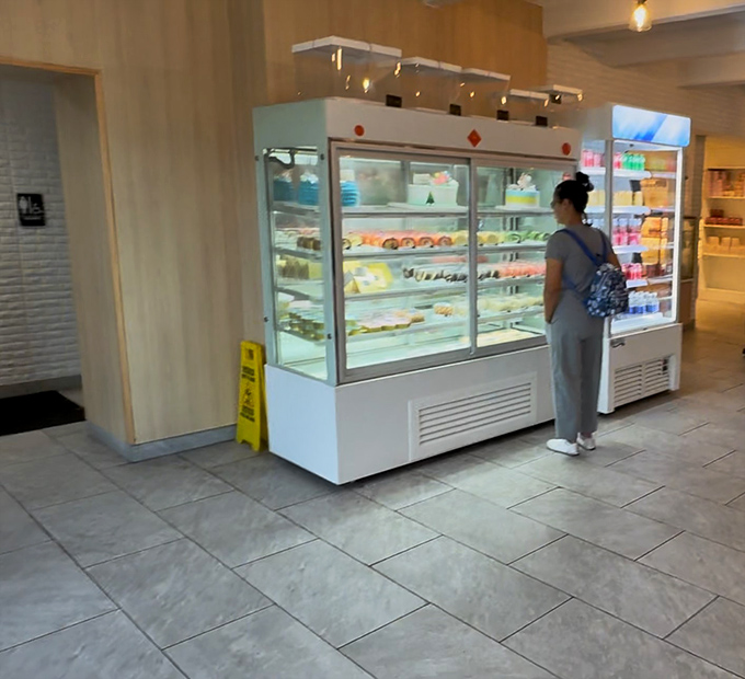 Behind glass doors lies a wonderland of pastries and cakes that would make Marie Antoinette say, "Forget bread, let them eat these instead!"