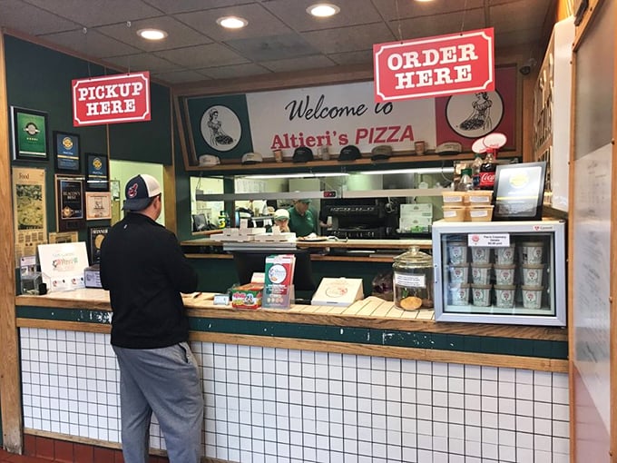 The sacred exchange: hungry customer, ready staff, and the promise of deliciousness just minutes away. A beautiful relationship.