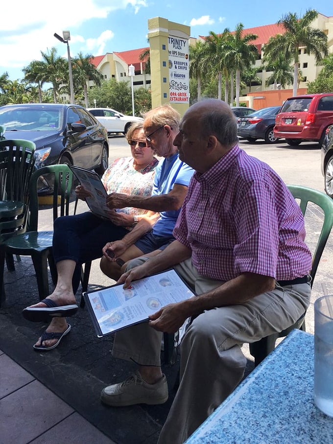 The outdoor seating area&mdash;where locals and tourists unite in the universal language of "Did you try the grouper sandwich yet?"