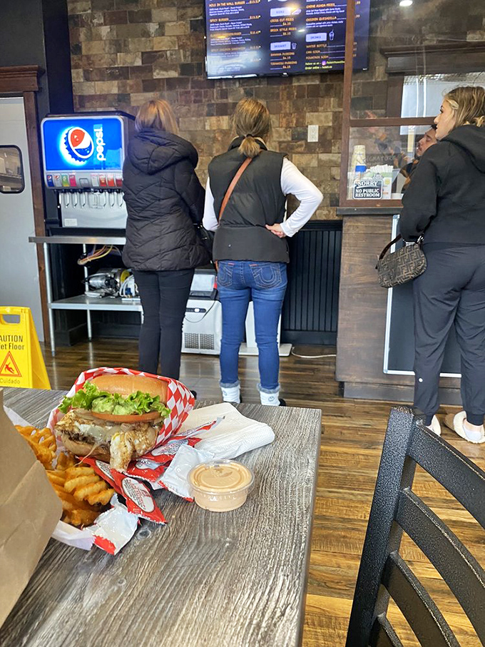 The line forms for a reason. When your burger comes out looking like this, the wait becomes just another part of the pilgrimage.