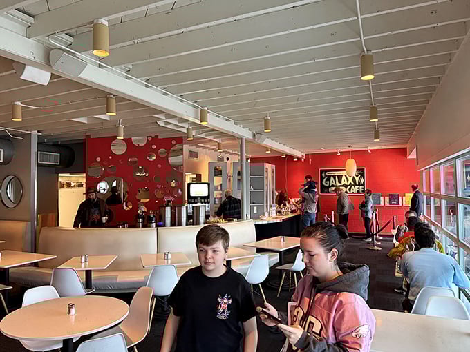 The bustling interior showcases Galaxy's signature red accent wall, where Austinites gather for their daily dose of breakfast bliss.