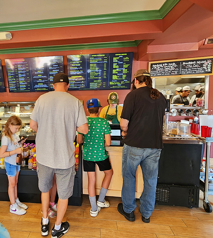 The universal language of anticipation&mdash;families waiting for cheese-laden delights while contemplating life's most important question: "Curds or sandwich first?"