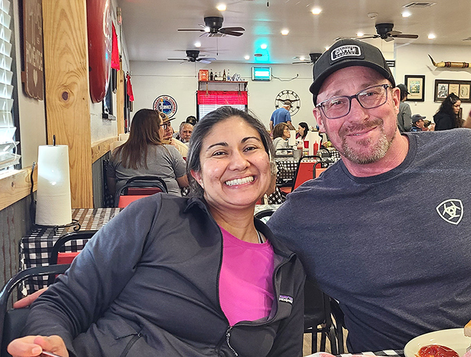 The true measure of a great local spot: genuine smiles that can't be faked. These folks aren't just customers; they're members of the Mel's family.