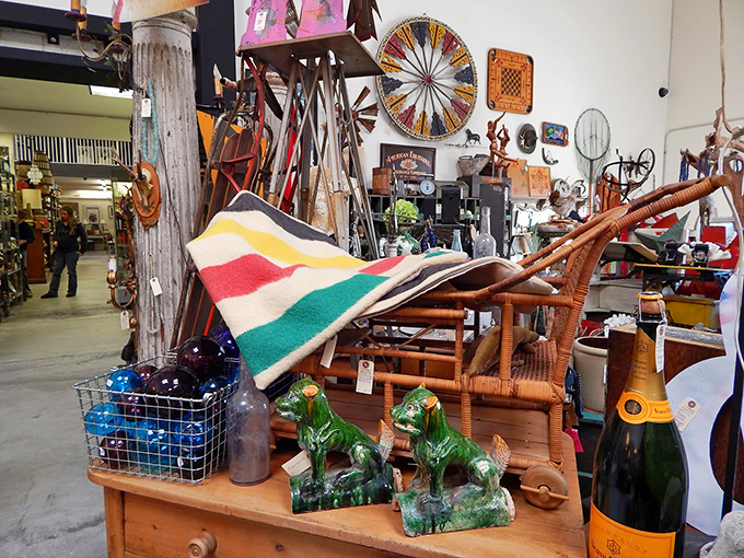 Wicker, wood, and whimsy collide in this corner where Hudson Bay blankets meet ceramic horses in a delightful dance of decorative randomness.