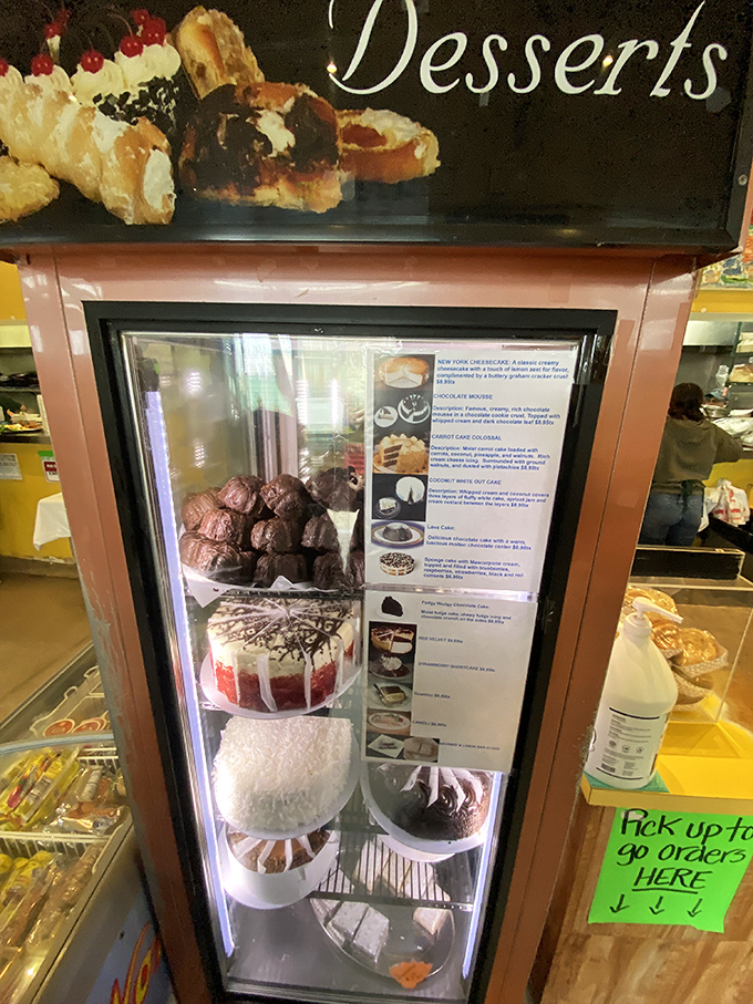 The dessert case stands as a sweet reminder that even after the most satisfying seafood feast, there's always room for a little something extra.