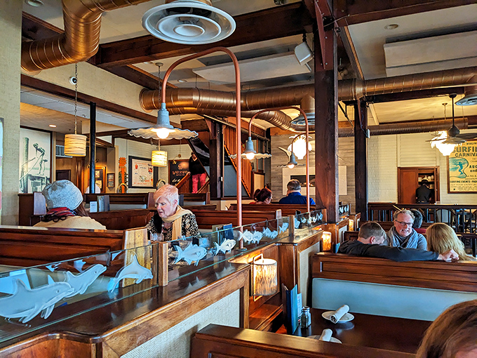 Where memories are made between bites&mdash;diners enjoying that perfect combination of good food, good company, and wooden booth comfort.