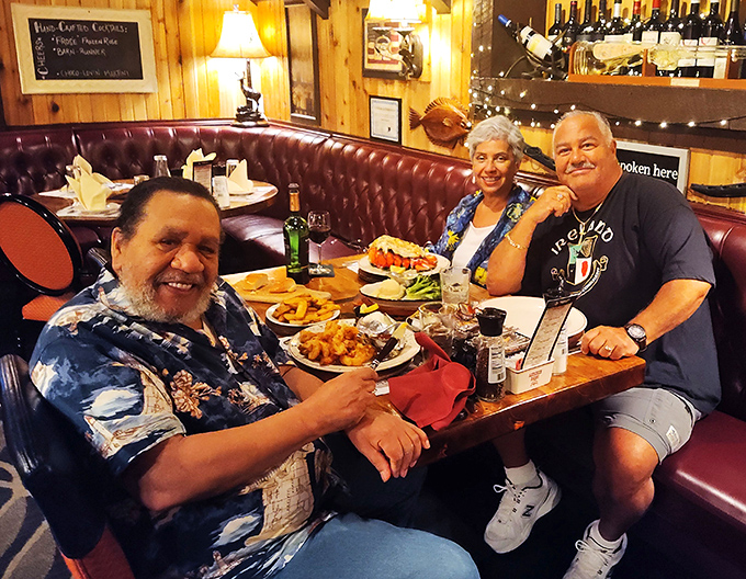 Happy diners proving that the best conversations happen over plates of perfectly prepared food and genuine Southern hospitality.