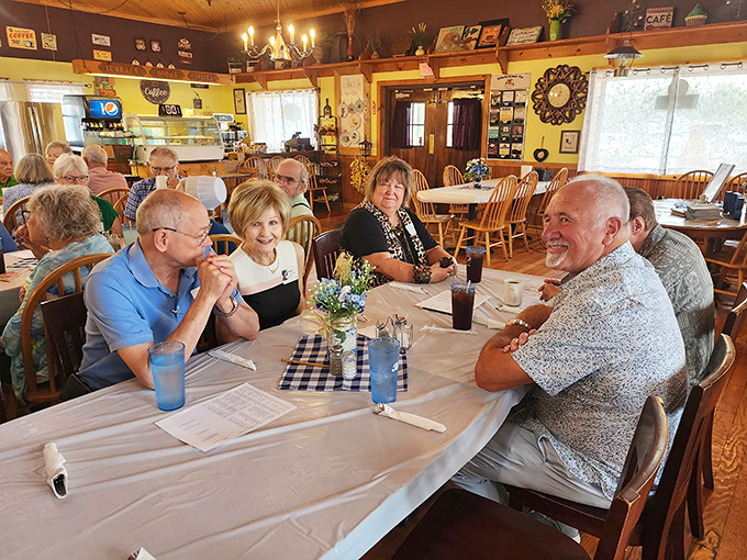 Happy diners sharing stories and coffee &ndash; the universal language of "this food was worth getting out of bed for" spoken around the table.