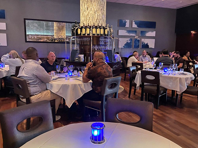 Where food enthusiasts gather under soft lighting to engage in humanity's oldest social ritual: breaking bread and sharing stories.