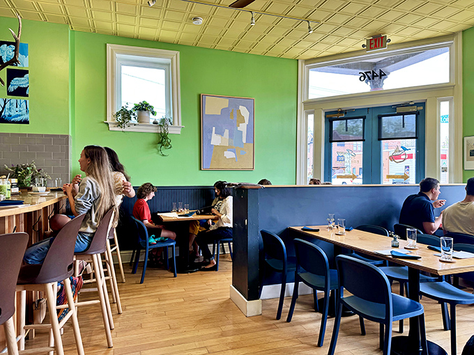 Diners bask in the glow of natural light streaming through windows, creating the perfect backdrop for morning conversations.